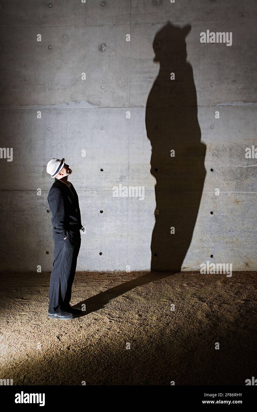 Person shadow looming hi-res stock photography and images - Alamy
