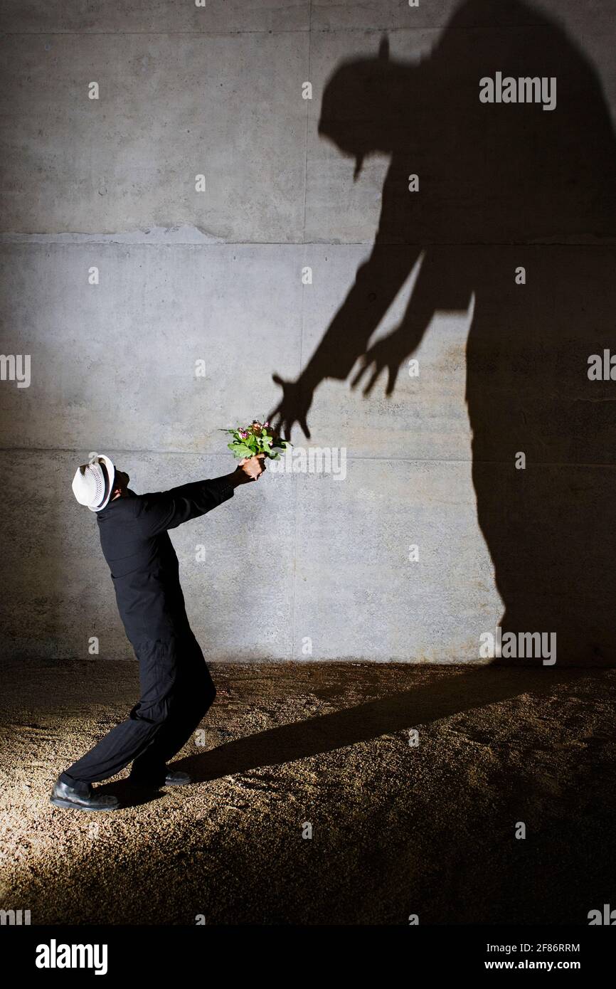 Person shadow looming hi-res stock photography and images - Alamy