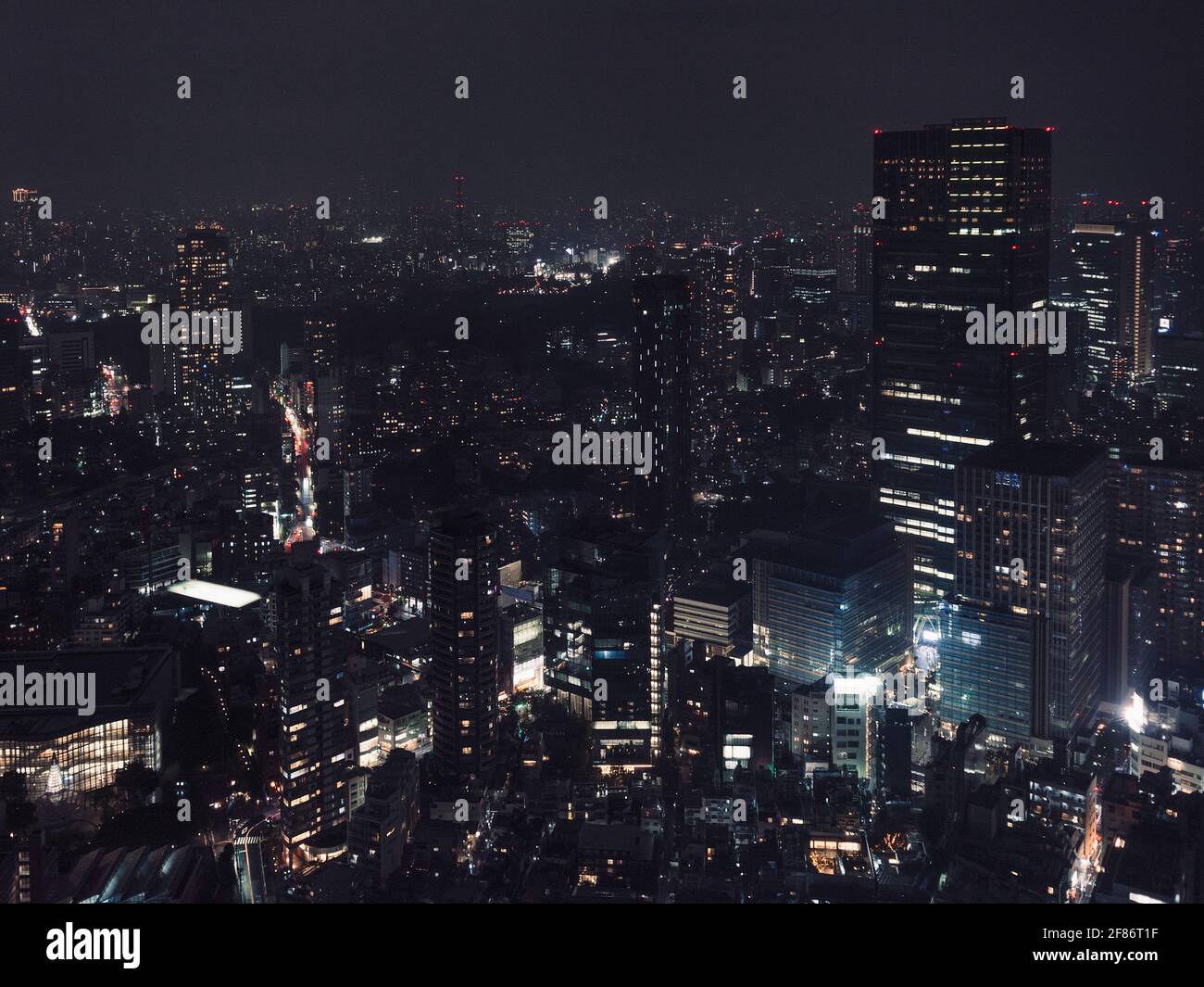 Illuminated buildings and cityscape at night, Tokyo, Japan Stock Photo ...