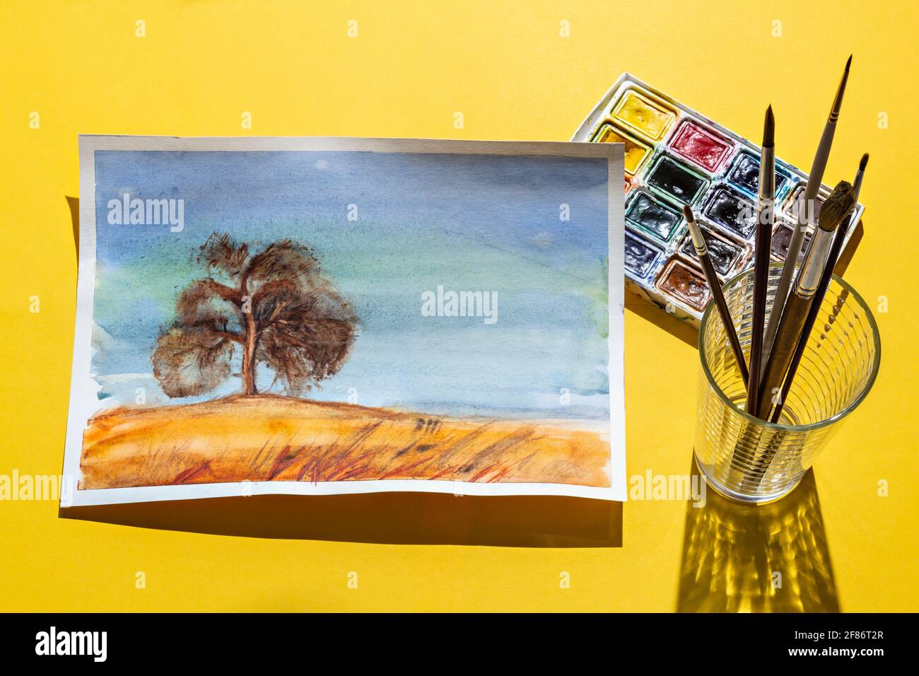Painting of tree on yellow background with paints and paintbrush Stock ...