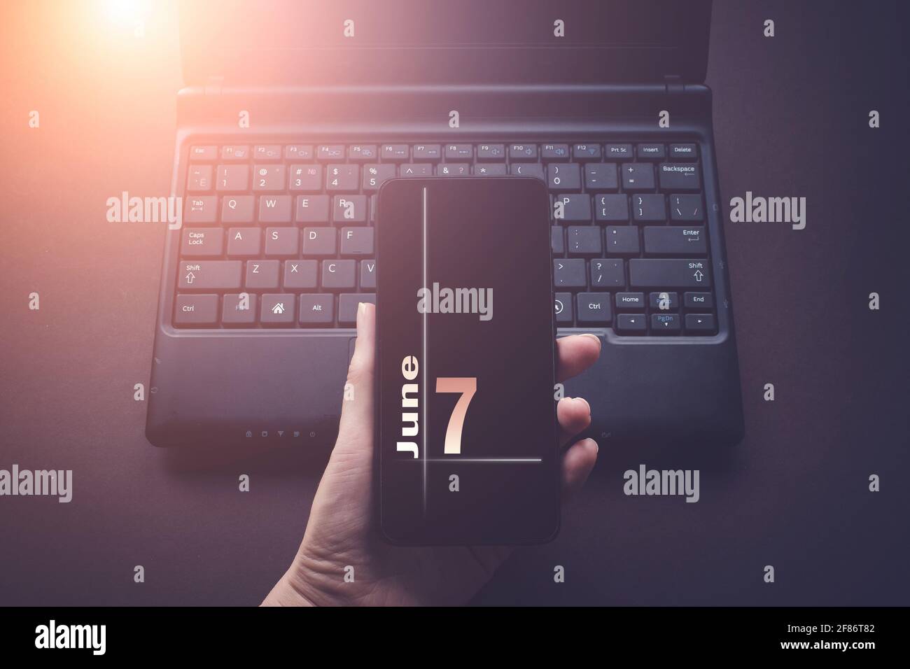 June 7th. Day 7 of month, Calendar date. Hand Holding Mobile Phone on ...