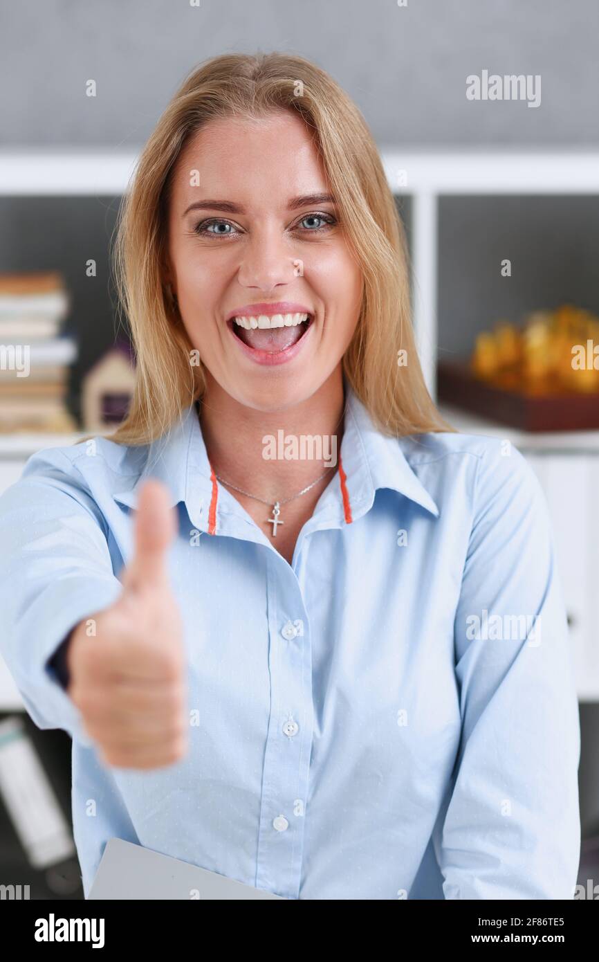 Female arm show OK or approval with thumb up Stock Photo - Alamy