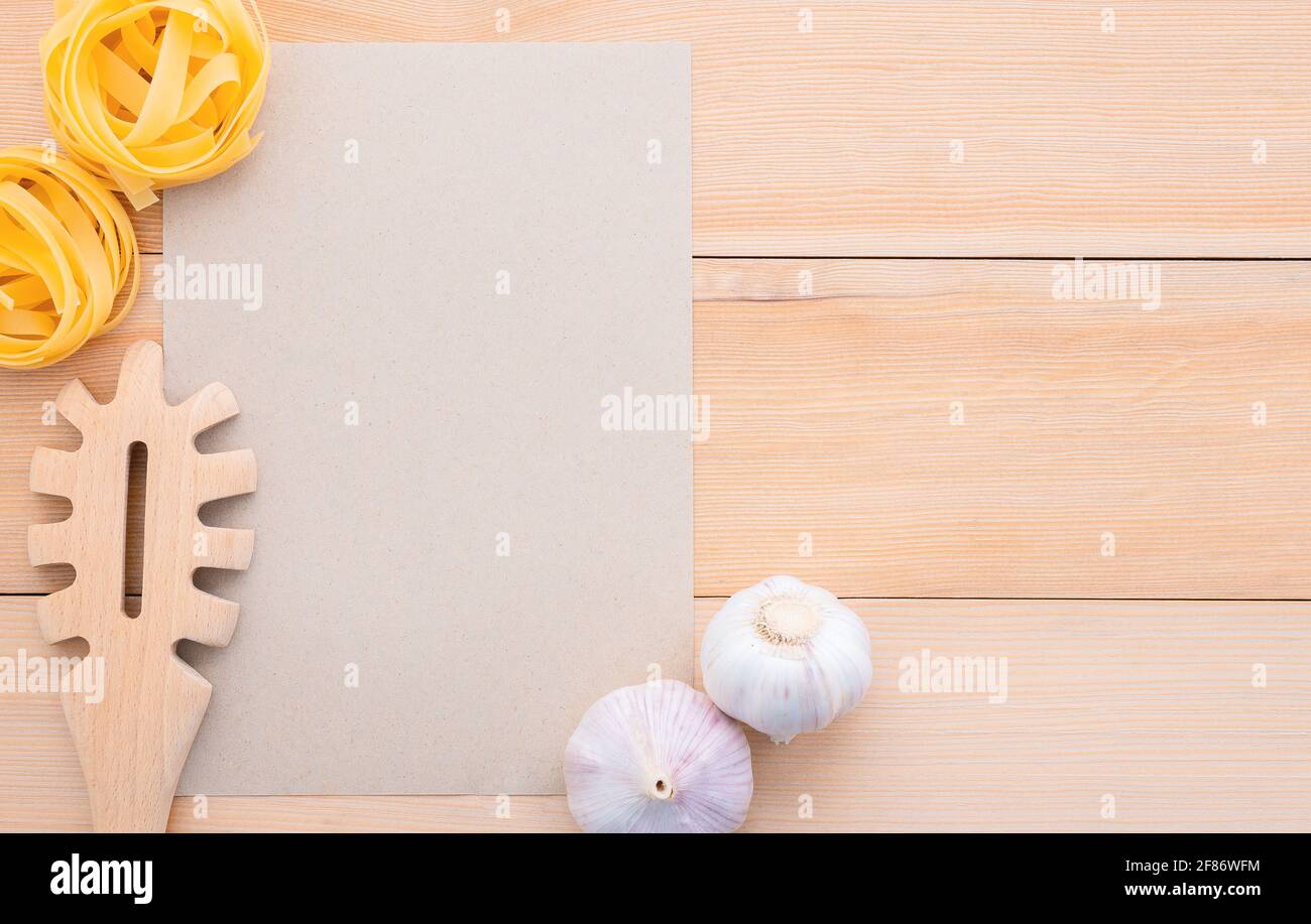 Food background for tasty Italian dishes with blank brown paper and ...