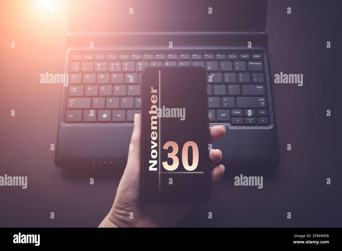 November 30th. Day 30 of month, Calendar date. Hand Holding Mobile ...