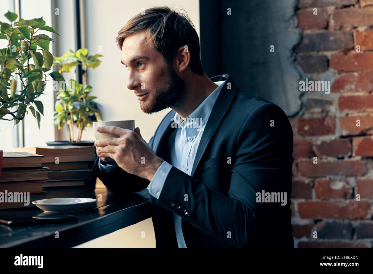 business man in a cafe suit drinking cafe rest breakfast Stock Photo ...