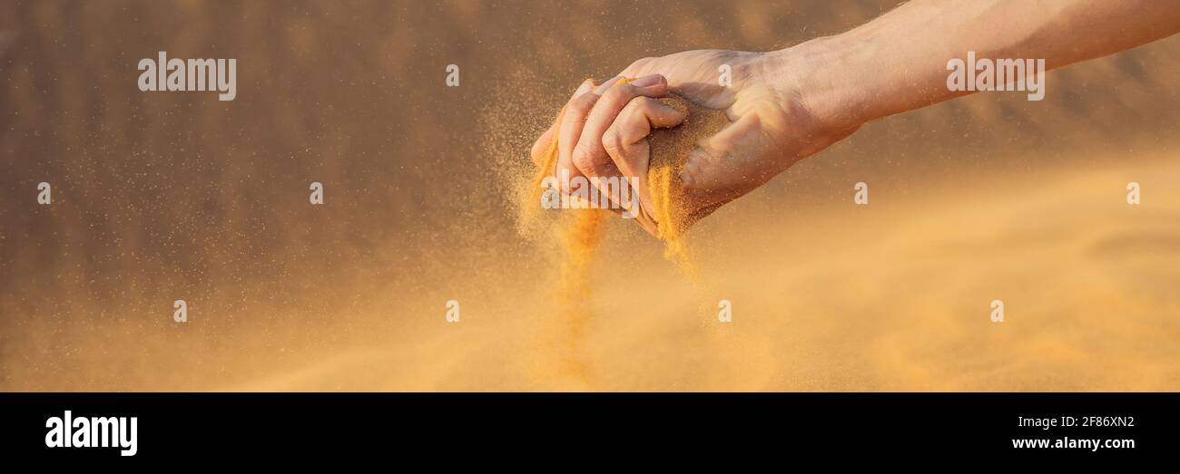 Sand running through fingers hi-res stock photography and images - Alamy
