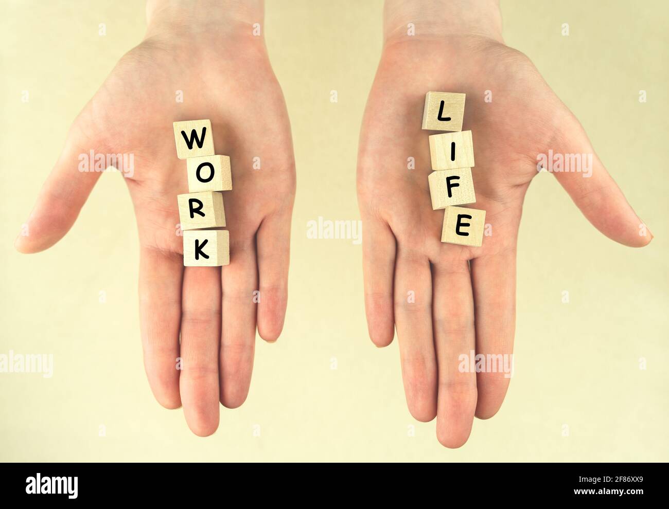 Work and life. Female hands with cubes on light background. Concept of ...