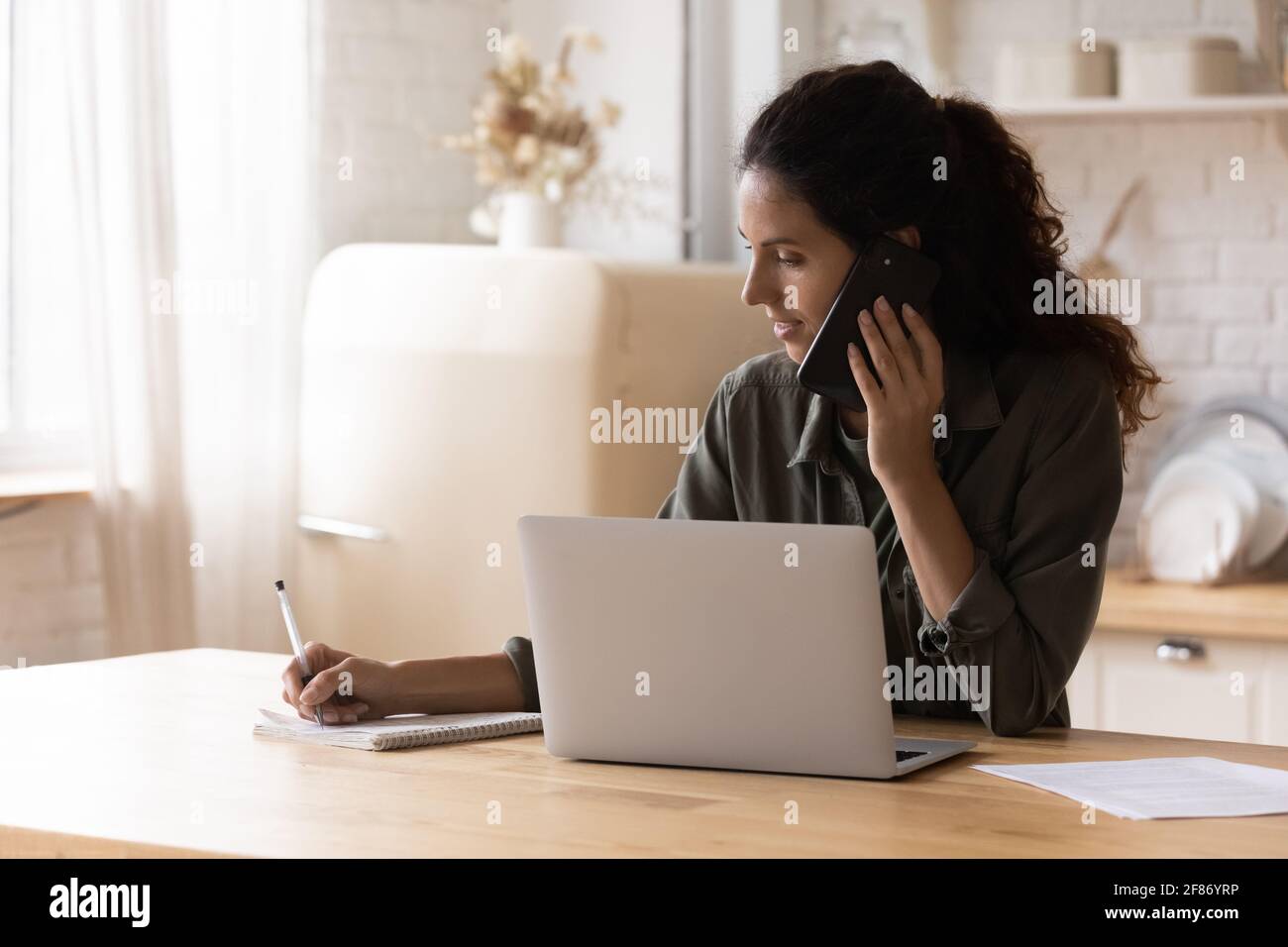 Woman laptop smartphone making hi-res stock photography and images - Alamy