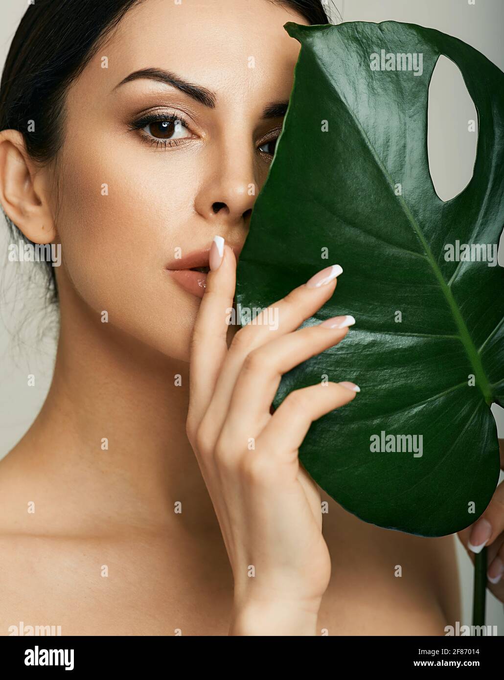 Healthy skin. Hispanic woman enjoying a clean smooth skin of her face ...