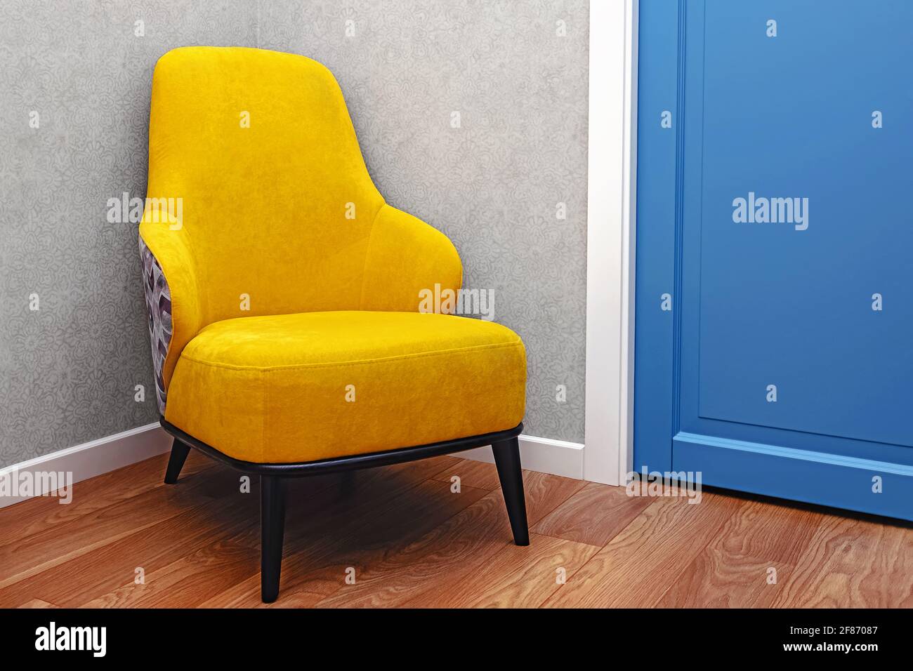 Yellow cozy armchair in modern interior room Stock Photo - Alamy