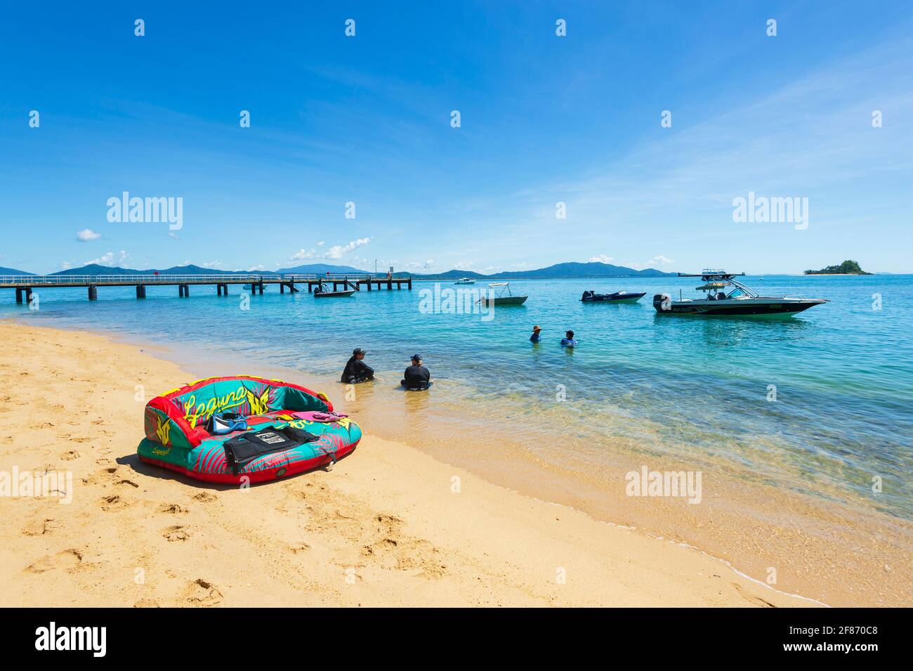 Tourists relaxing on the beach at Dunk Island, Queensland, QLD ...