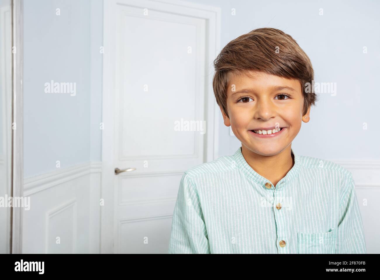 Calm positive portrait of little boy at home smile Stock Photo - Alamy