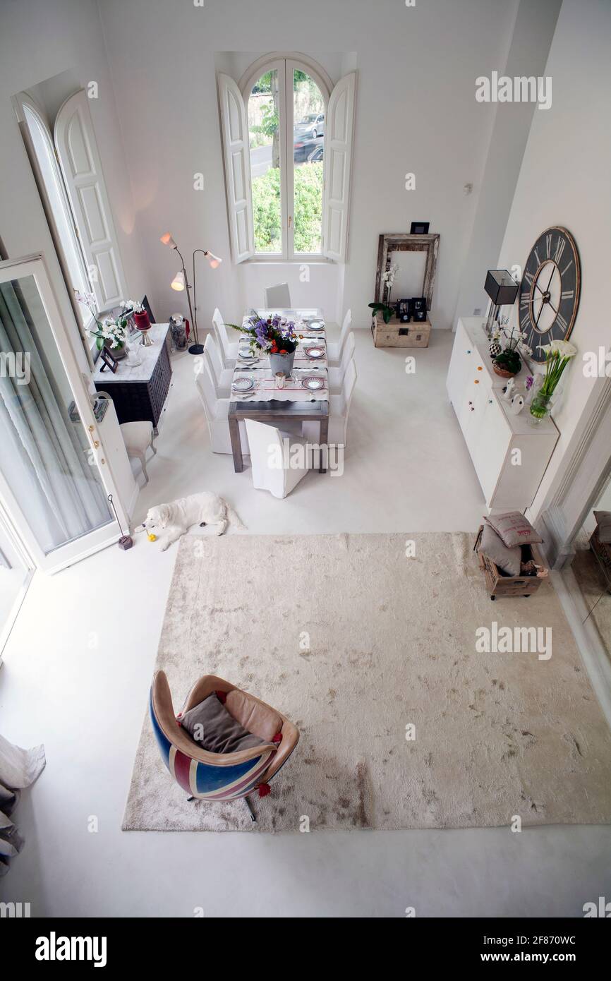 LIving room in a elegant house with table set up Stock Photo - Alamy