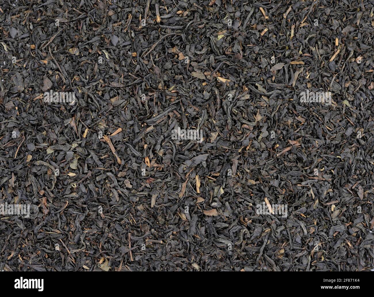 Dry black tea leaves background. Ful frame black tea background. Black ...