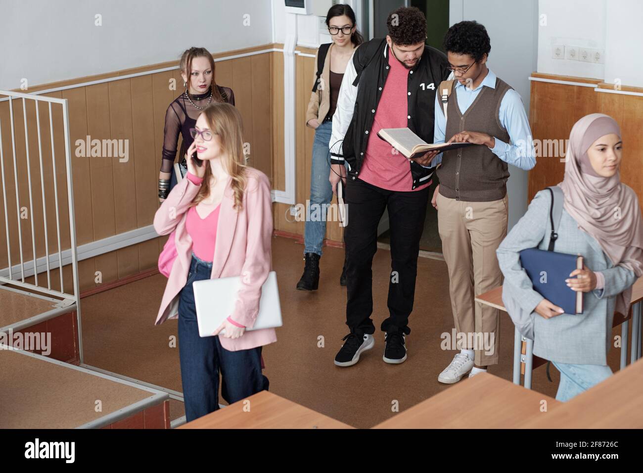 University student entering building hi-res stock photography and ...