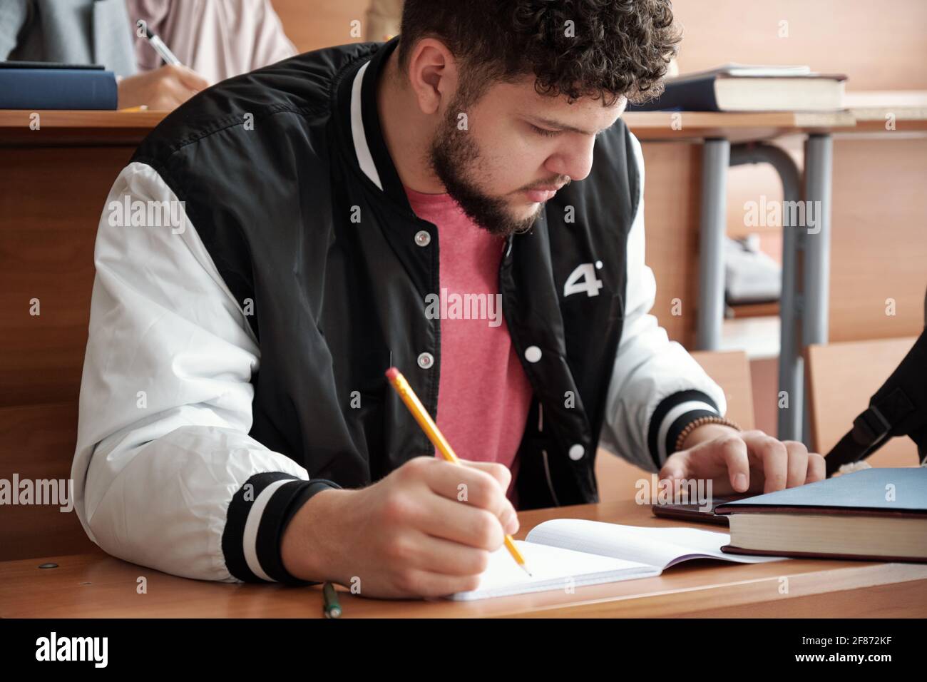 Student sitting desk scrolling computer hi-res stock photography and ...