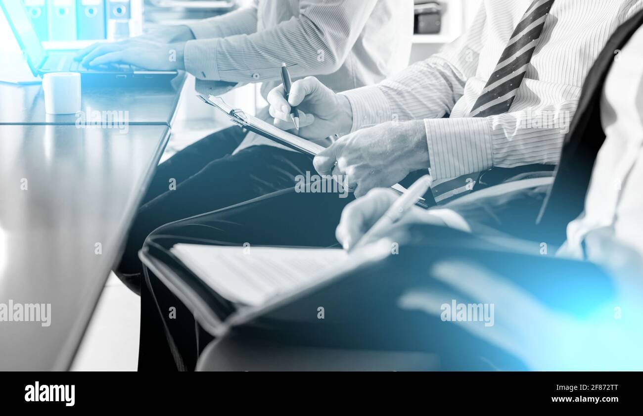 Business people taking notes during a training; light effect Stock ...