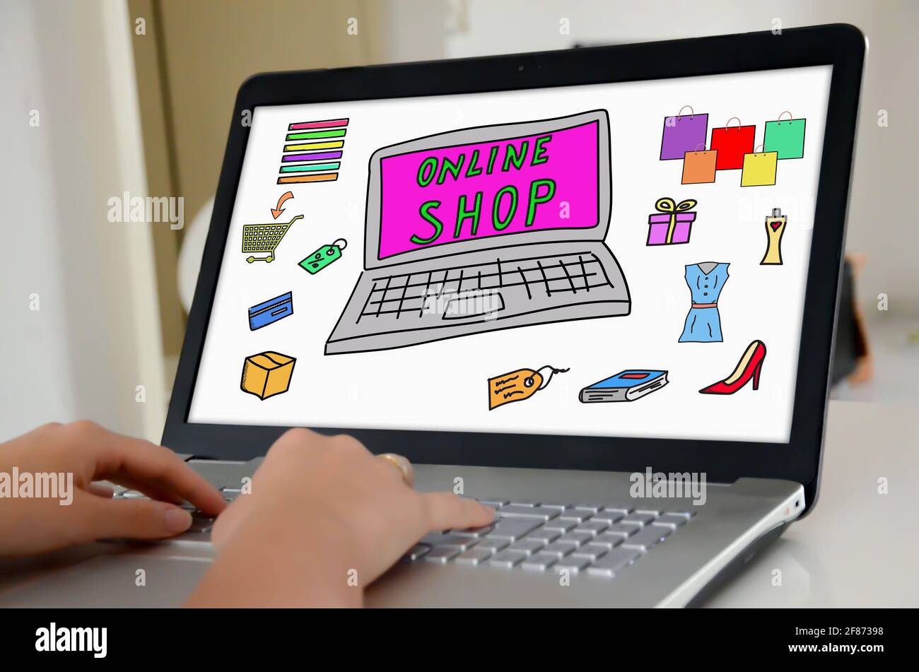 Hands on a laptop with screen showing online shop concept Stock Photo ...