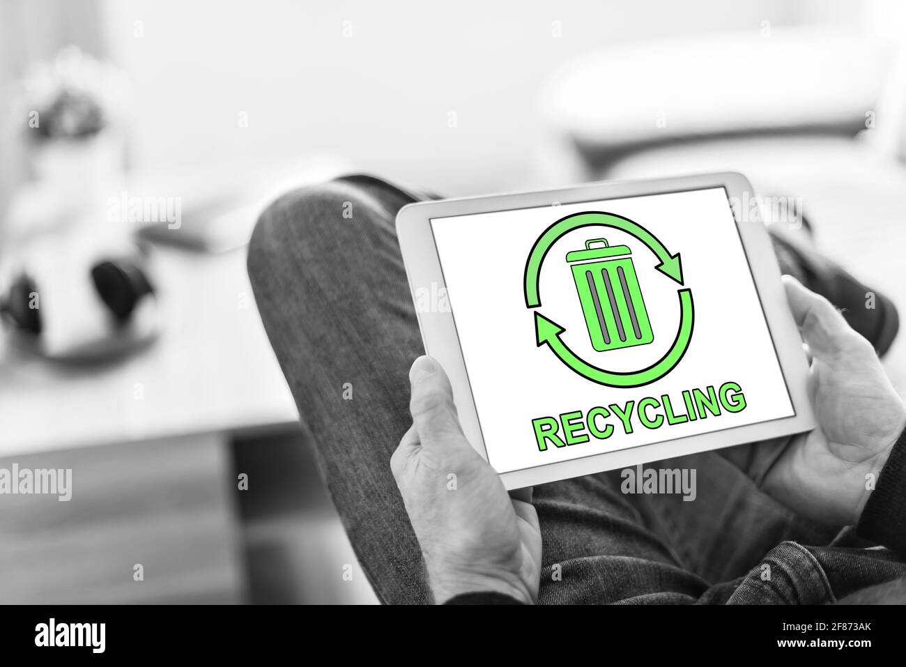 Tablet screen displaying a recycling concept Stock Photo - Alamy