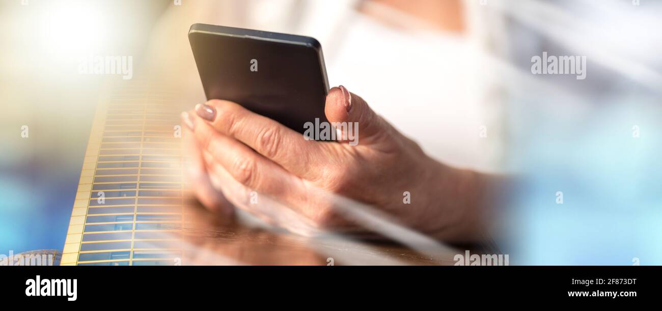 Close up of woman's hands using a mobile phone; multiple exposure Stock ...