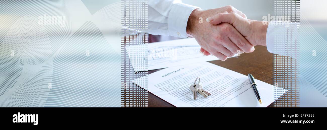Estate agent shaking hands with his customer after contract signature ...