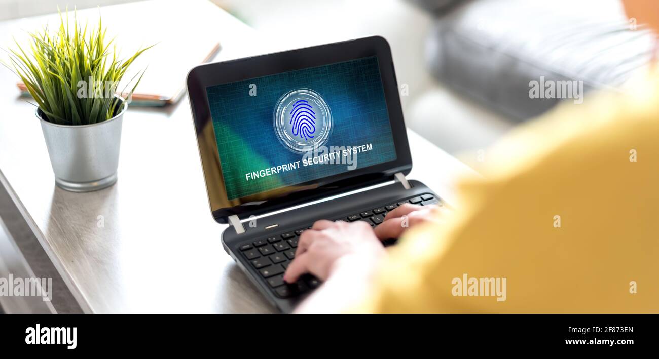 Laptop screen displaying a fingerprint security system concept Stock ...