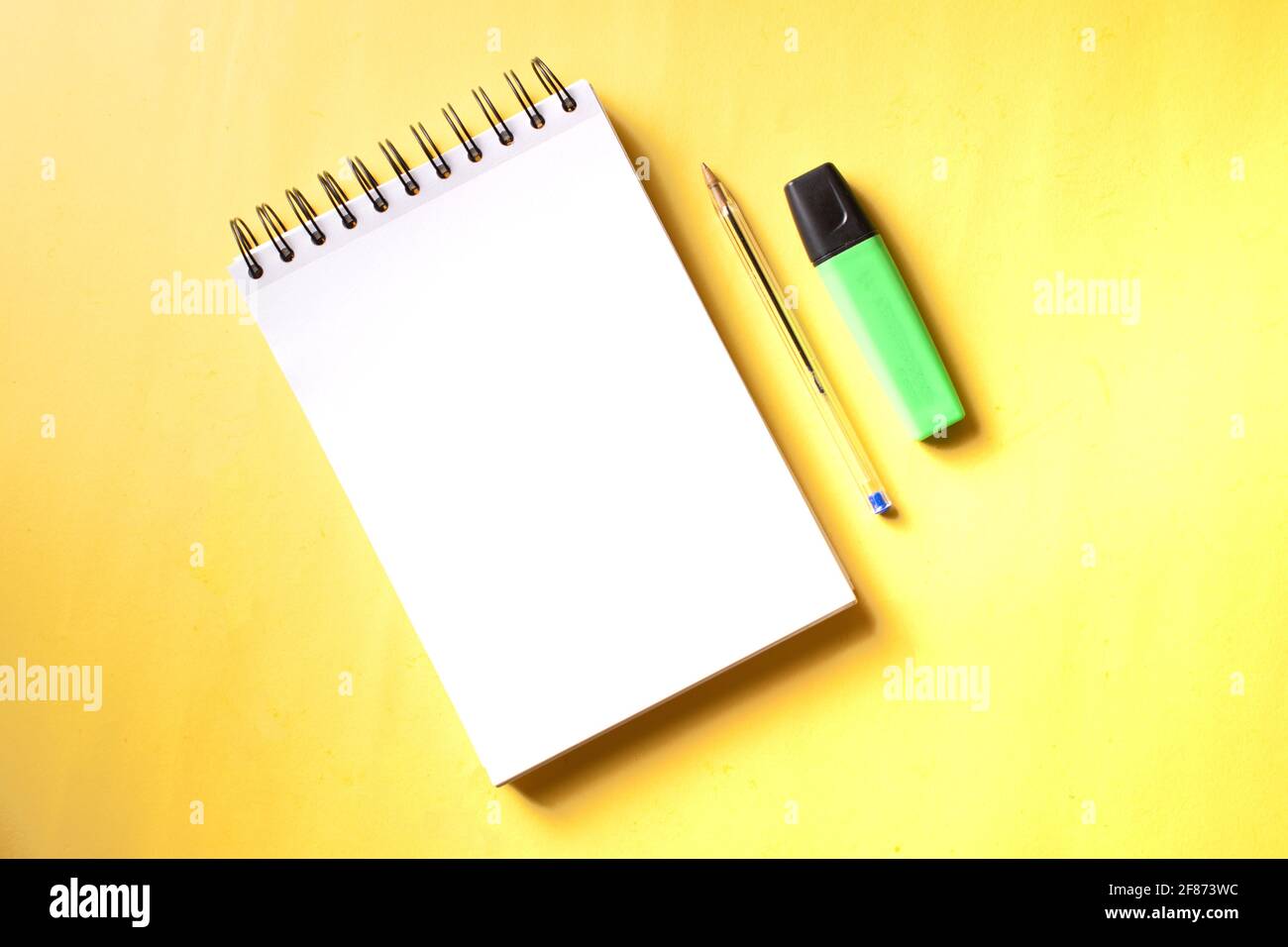 Top view ring binder notebook, pen and highlighter, phosphorescent ...