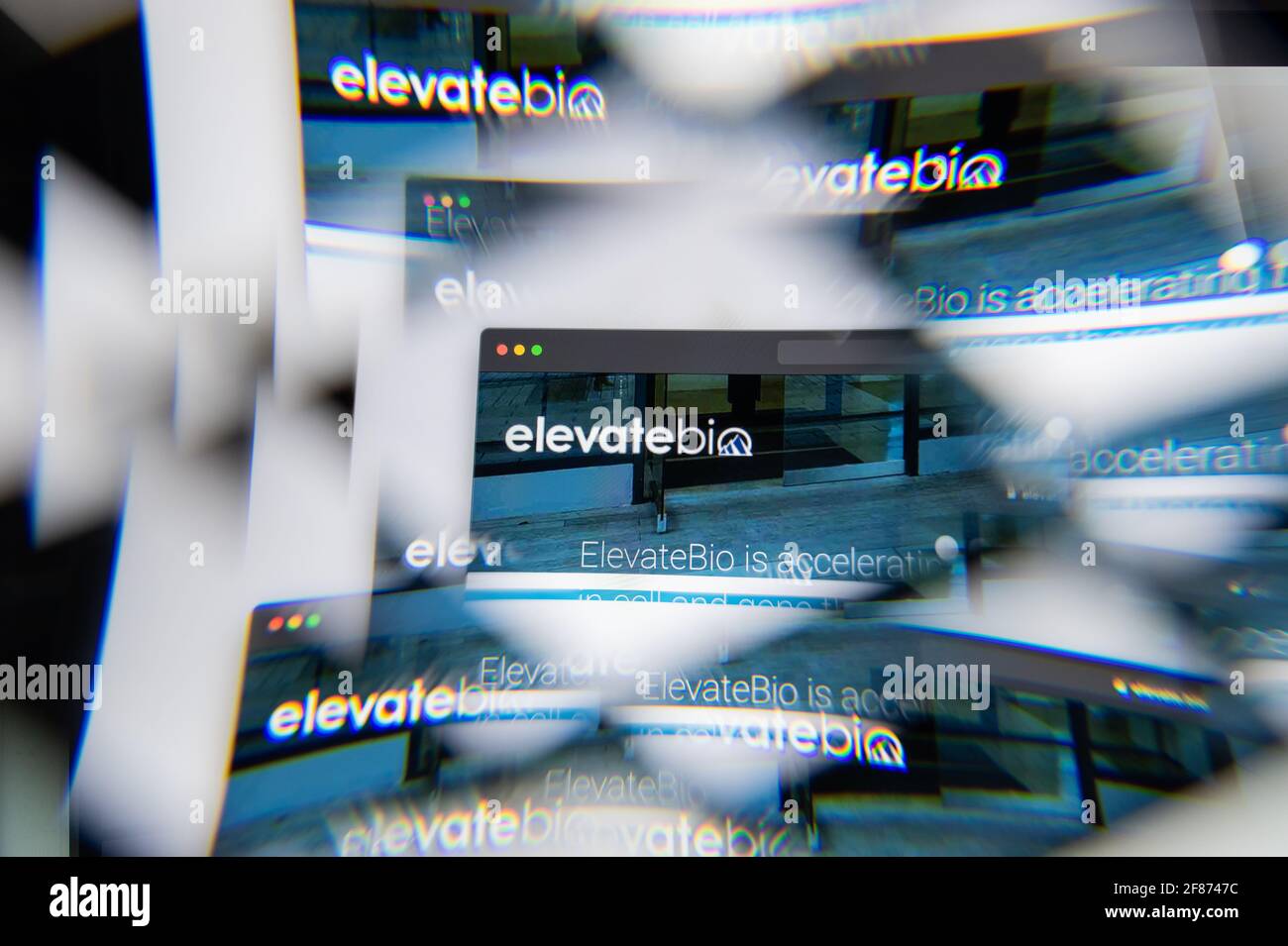 Milan, Italy - APRIL 10, 2021: ElevateBio logo on laptop screen seen through an optical prism ...