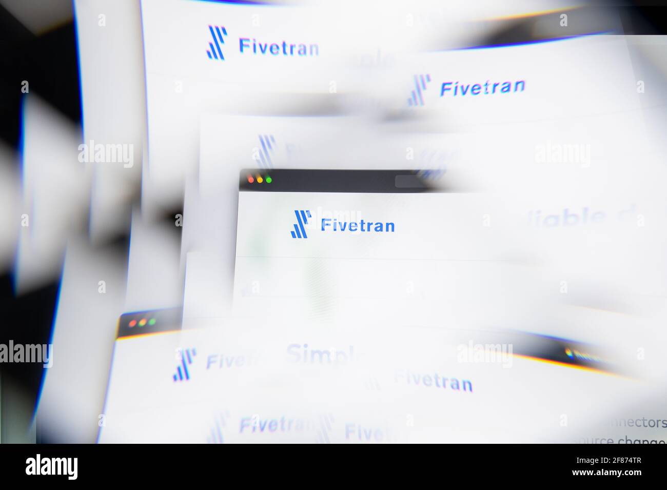 Milan, Italy - APRIL 10, 2021: Fivetran logo on laptop screen seen through an optical prism ...