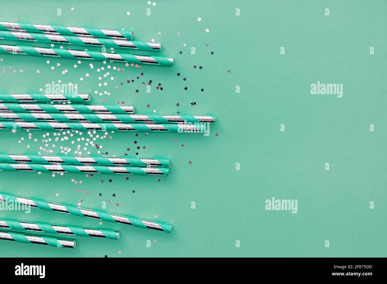 Metallic and turquoise paper straws and shiny glitter Stock Photo - Alamy