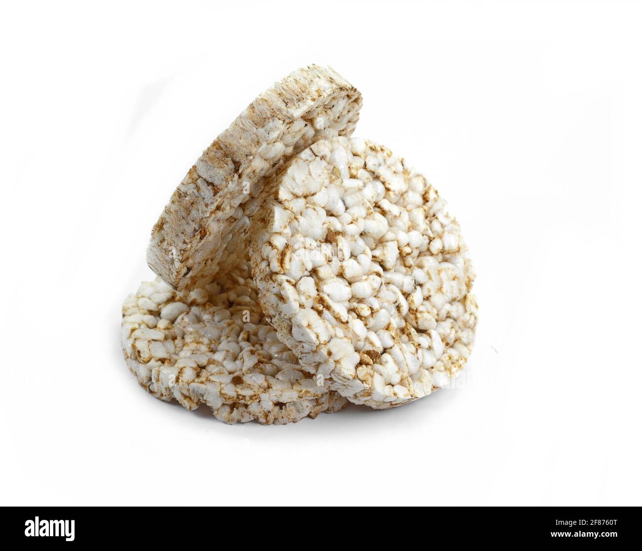Puffed rice cakes isolated on white. Stack of puffed whole grain ...