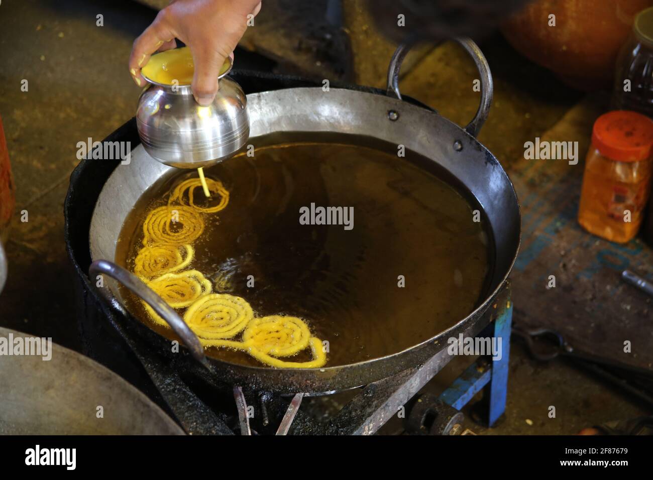 Jalebi in hand hi-res stock photography and images - Alamy