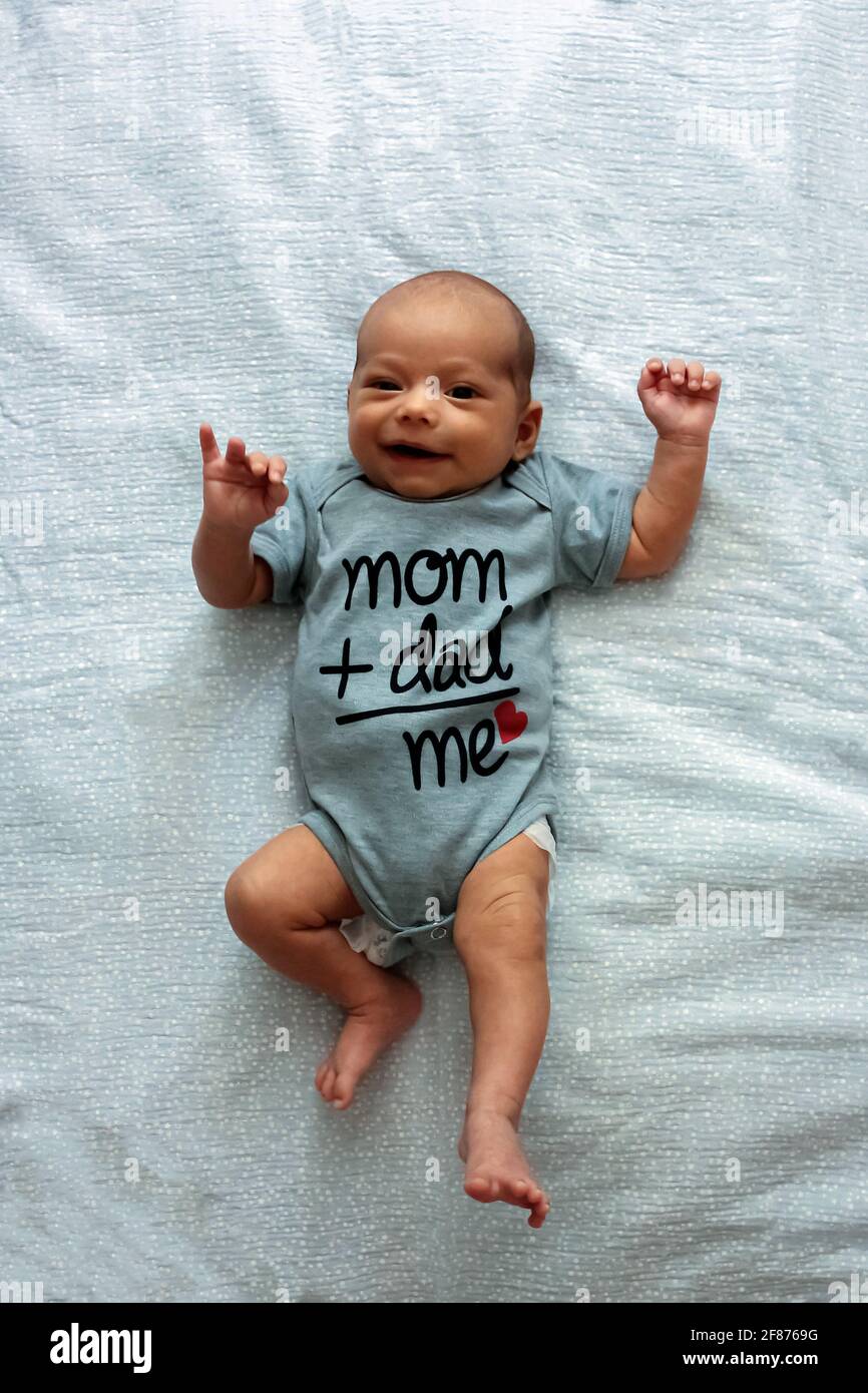 Happy little baby with smiling face. Cute infant laying on bed Stock ...