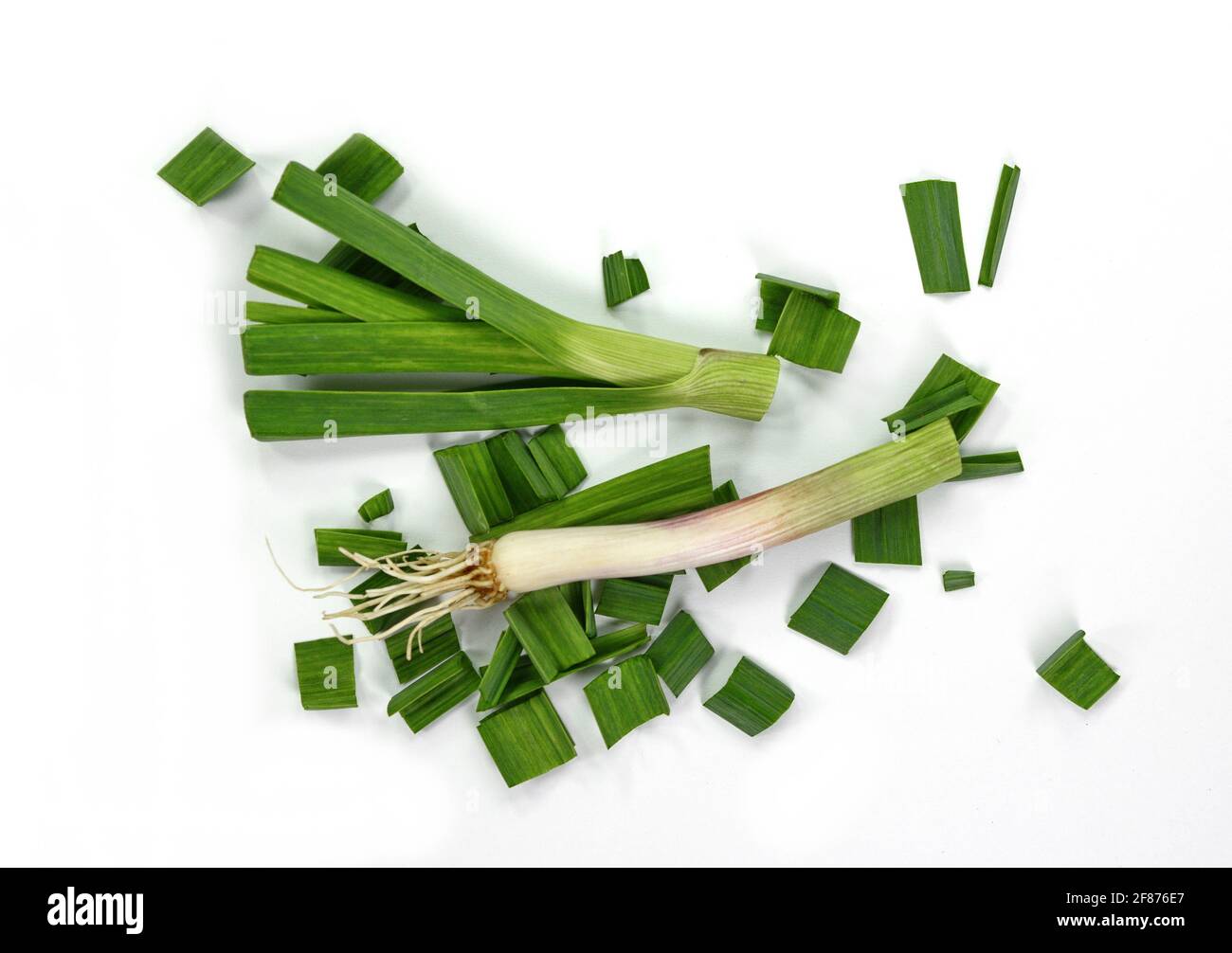Fresh green garlic isolated on white background. Chopped green garlic ...