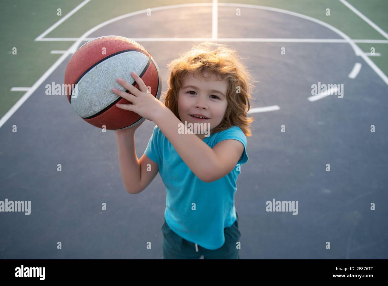 Cute child playing basketball. Sport for kids Stock Photo - Alamy