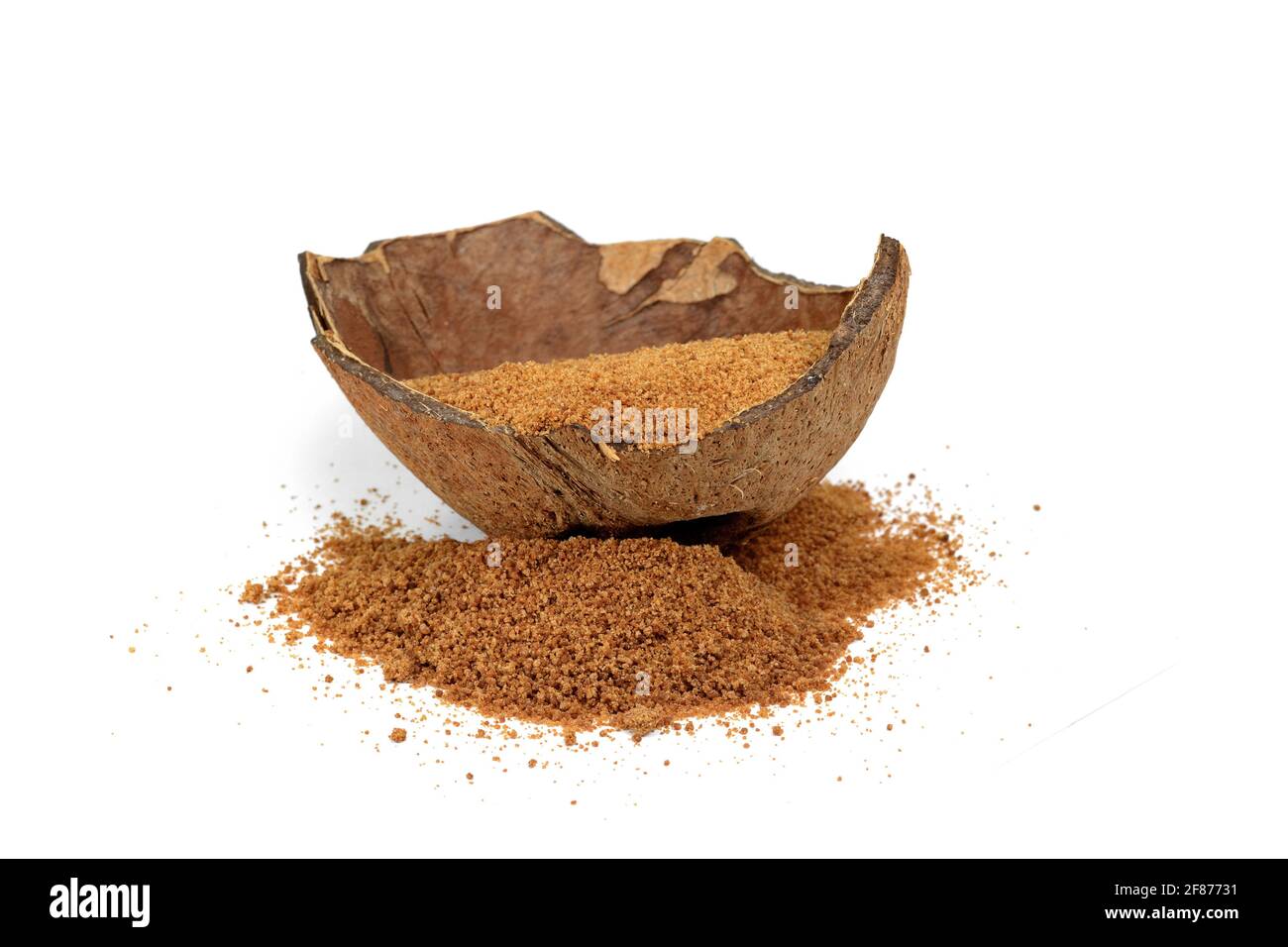 Sweet coconut sugar in coconut shell isolated on white background Stock ...