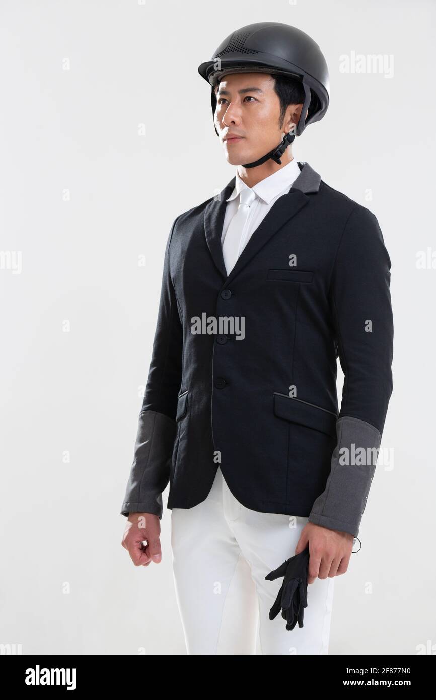 Young man in riding clothes Stock Photo - Alamy