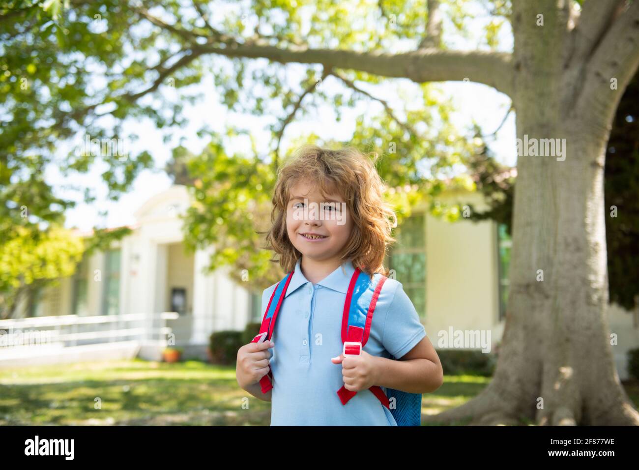Portrait happy kids backpacks hi-res stock photography and images - Alamy