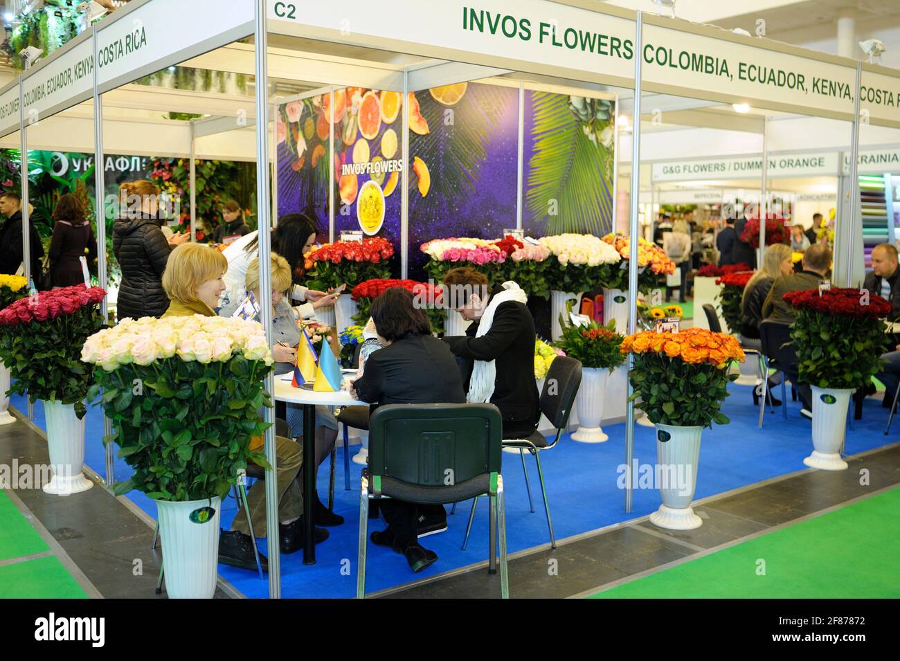 People sitting in a lounge zone among bouquets of flowers. April 17 ...