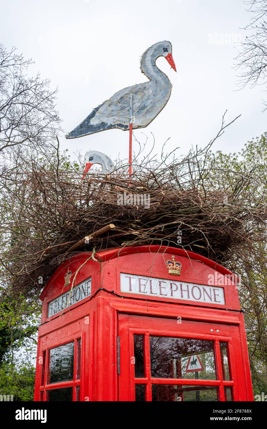 Red phone box decorated for Easter with an artificial storks nest on ...