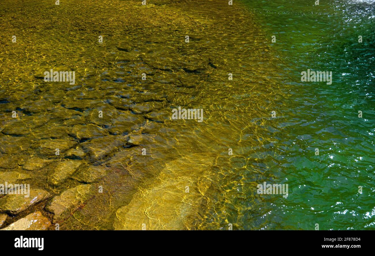 View from above into a shimmering river Stock Photo - Alamy