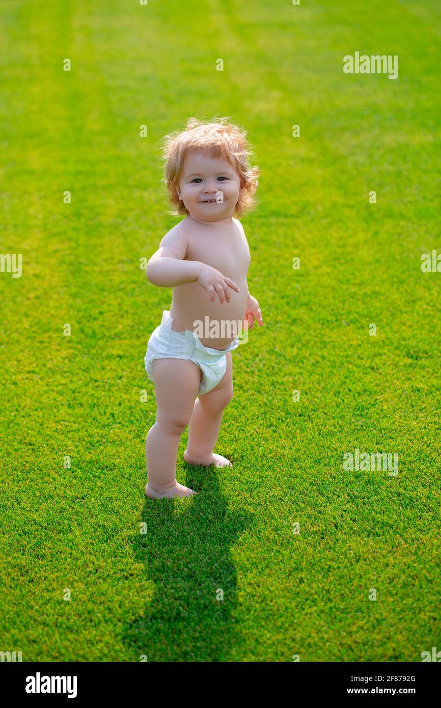 Cute funny laughing baby learning to crawl, having fun playing on the ...