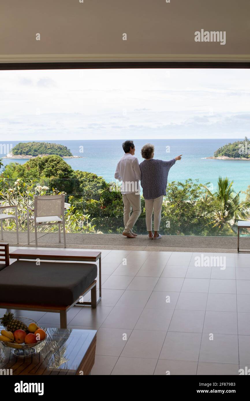 Couple pointing side on full length hi-res stock photography and images ...