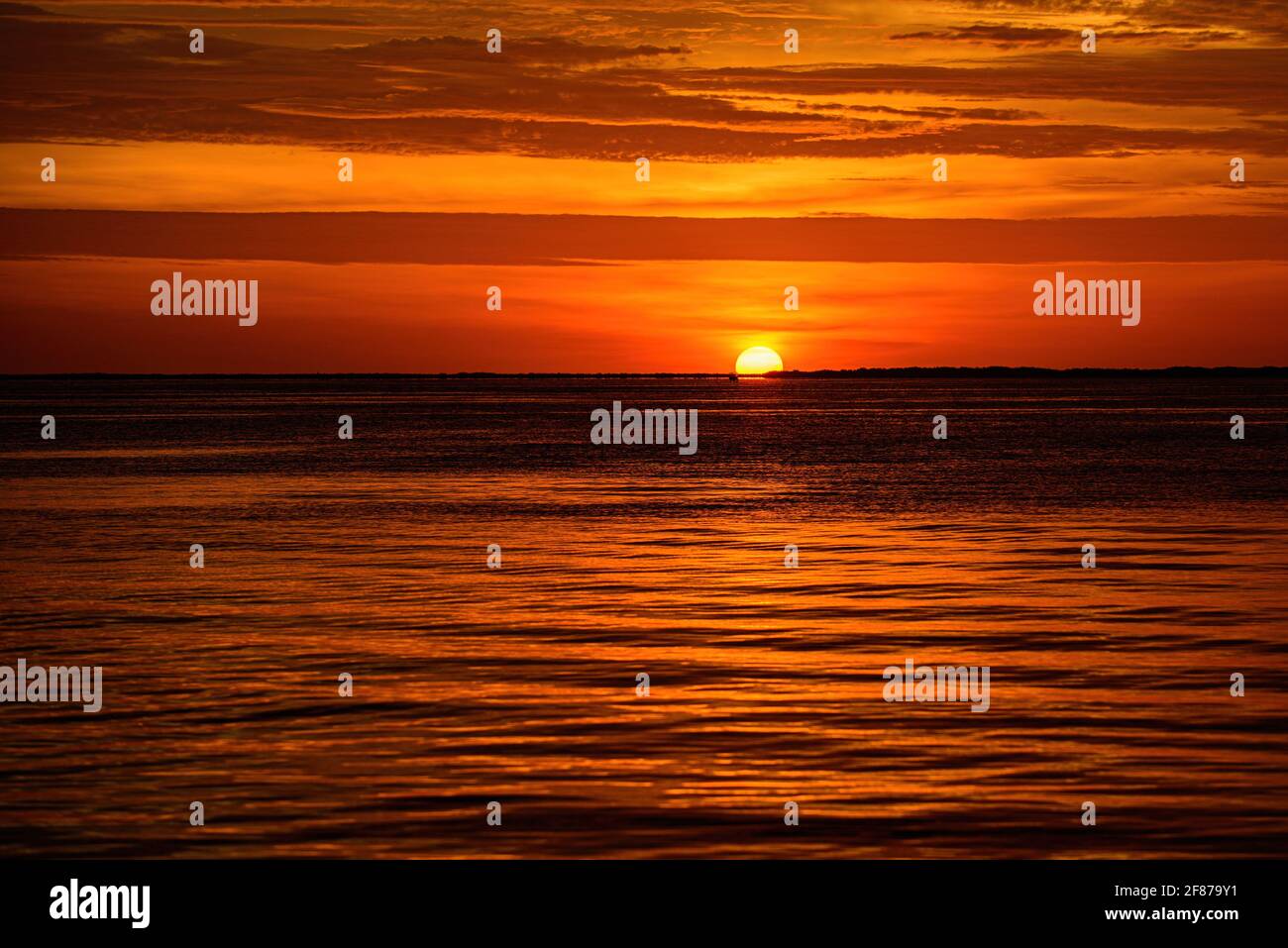 Sunrise sun over skyline horizon. Natural sunset over ocean. Dramatic ...