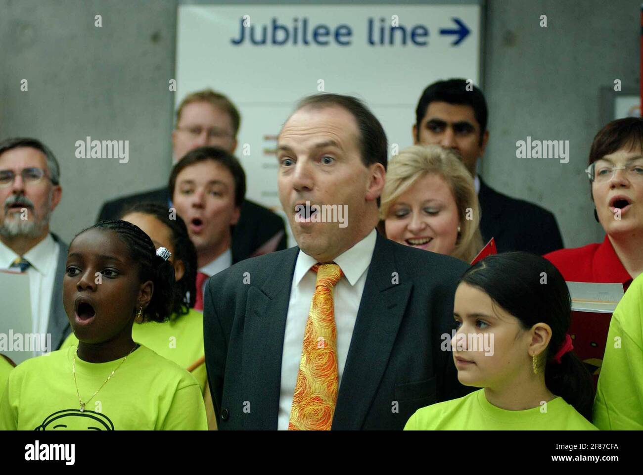 SIMON HUGES AMONG MPS AND CHILDREN SINGING A RENDITION OF 'ALL YOU NEED ...