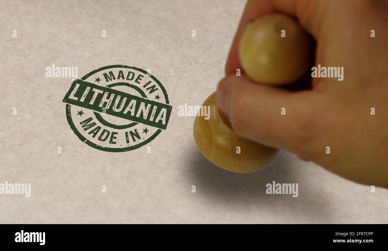 Made in Lithuania stamp and stamping hand. Factory, manufacturing and ...