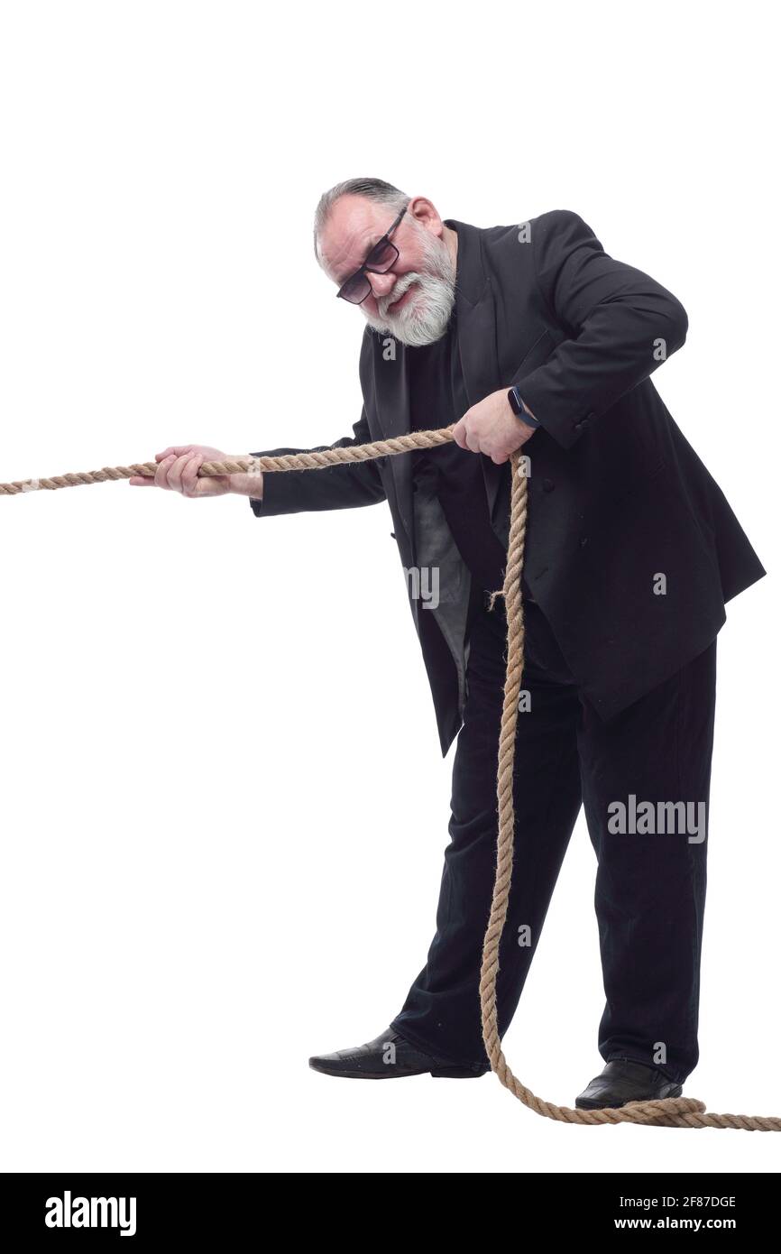 Mature businessman pulling a rope . isolated on a white background ...
