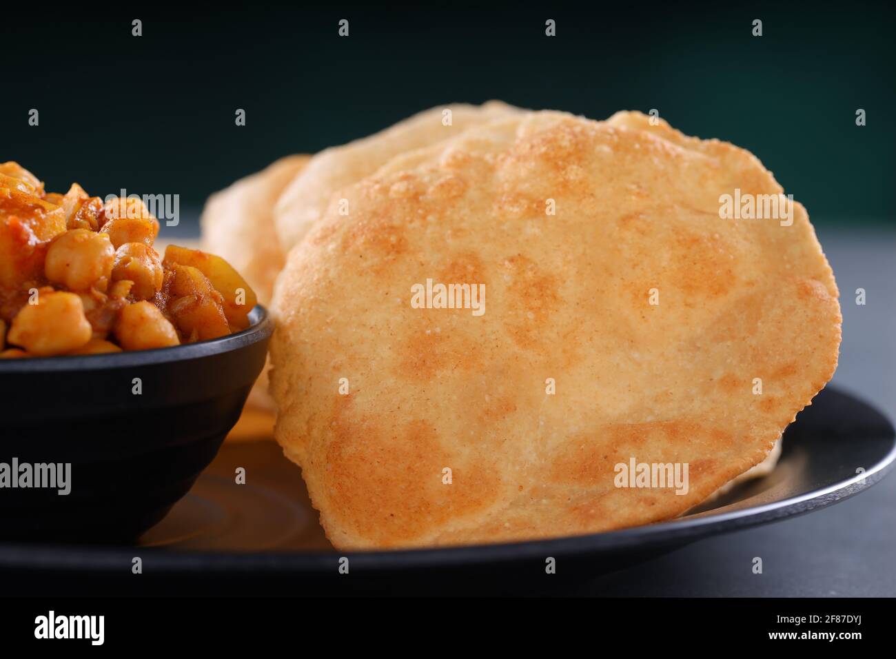 Indian breakfast Puri with chickpea chana masala curry,tasty indian ...