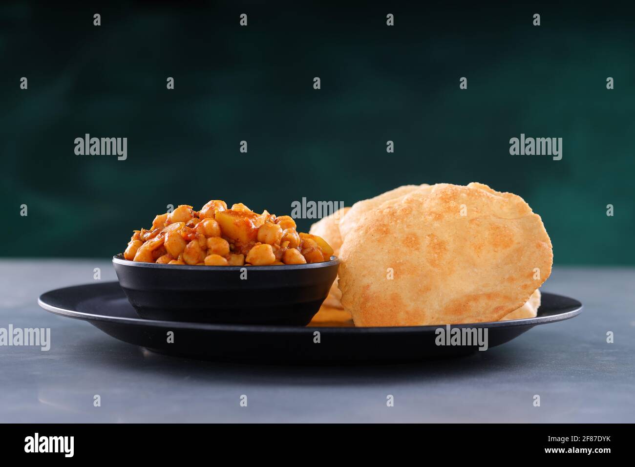Indian breakfast Puri with chickpea chana masala curry,tasty indian ...