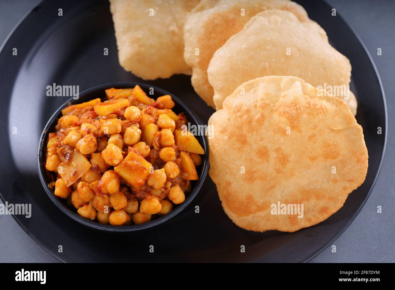 Indian breakfast Puri with chickpea chana masala curry,tasty indian ...